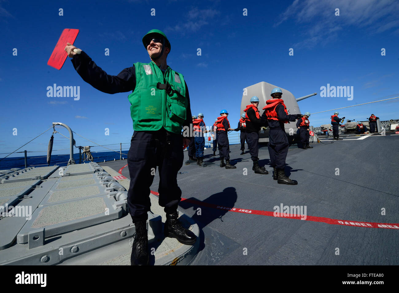 Religious Programs Specialist 2nd Class Ryne Becker signals during ...