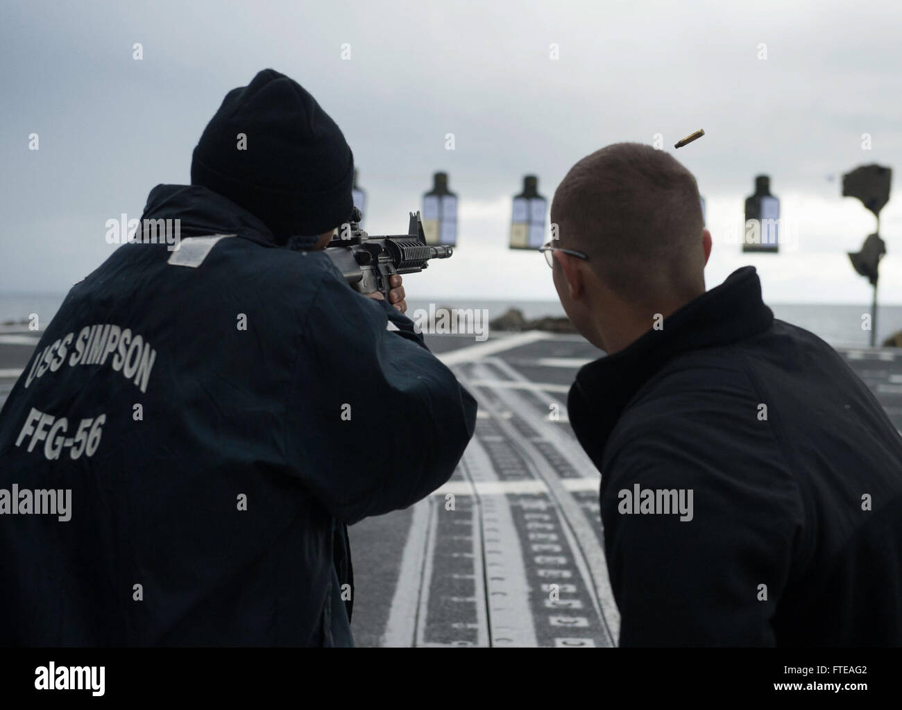 Ship's Serviceman 3rd Class Bernard Ford practices M-4 rifle firing ...