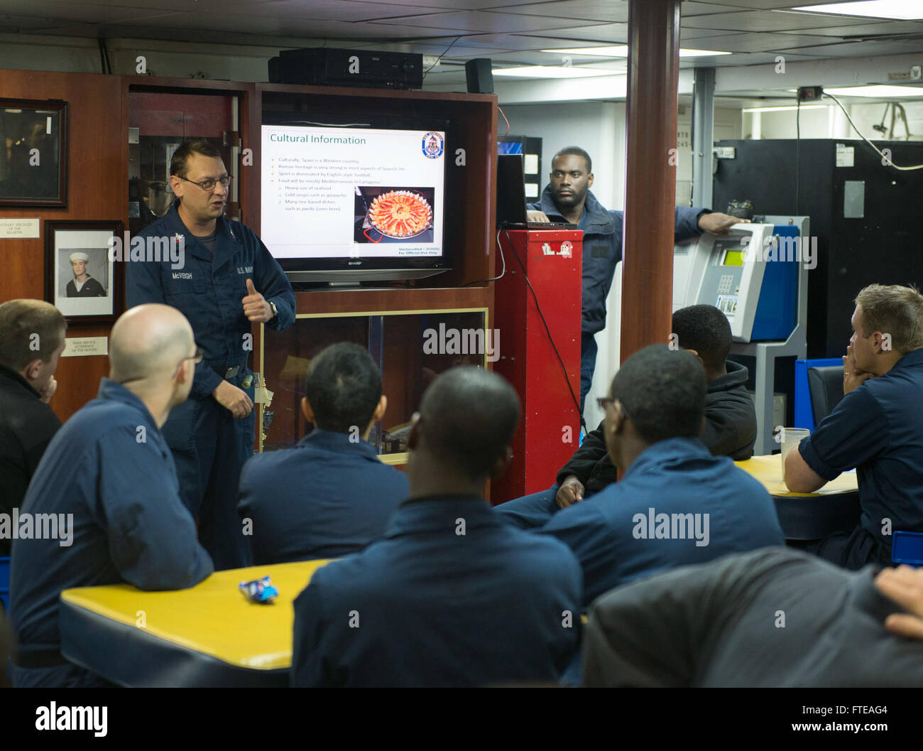 Sonar Technician 2nd Class Michael McVeigh briefs the crew of the USS ...