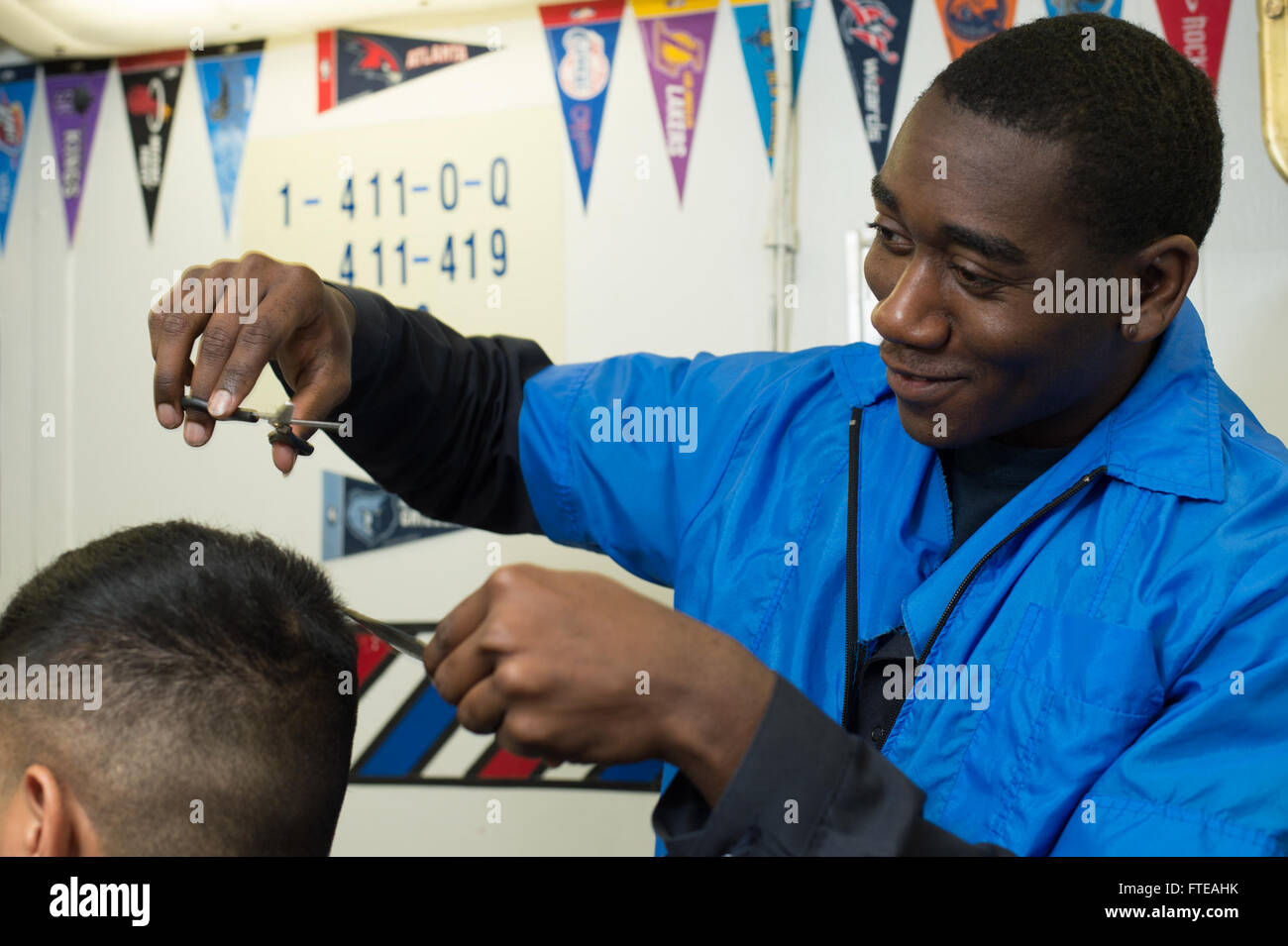Ship's Serviceman Seaman Earnest Gates, aboard the USS Philippine Sea ...