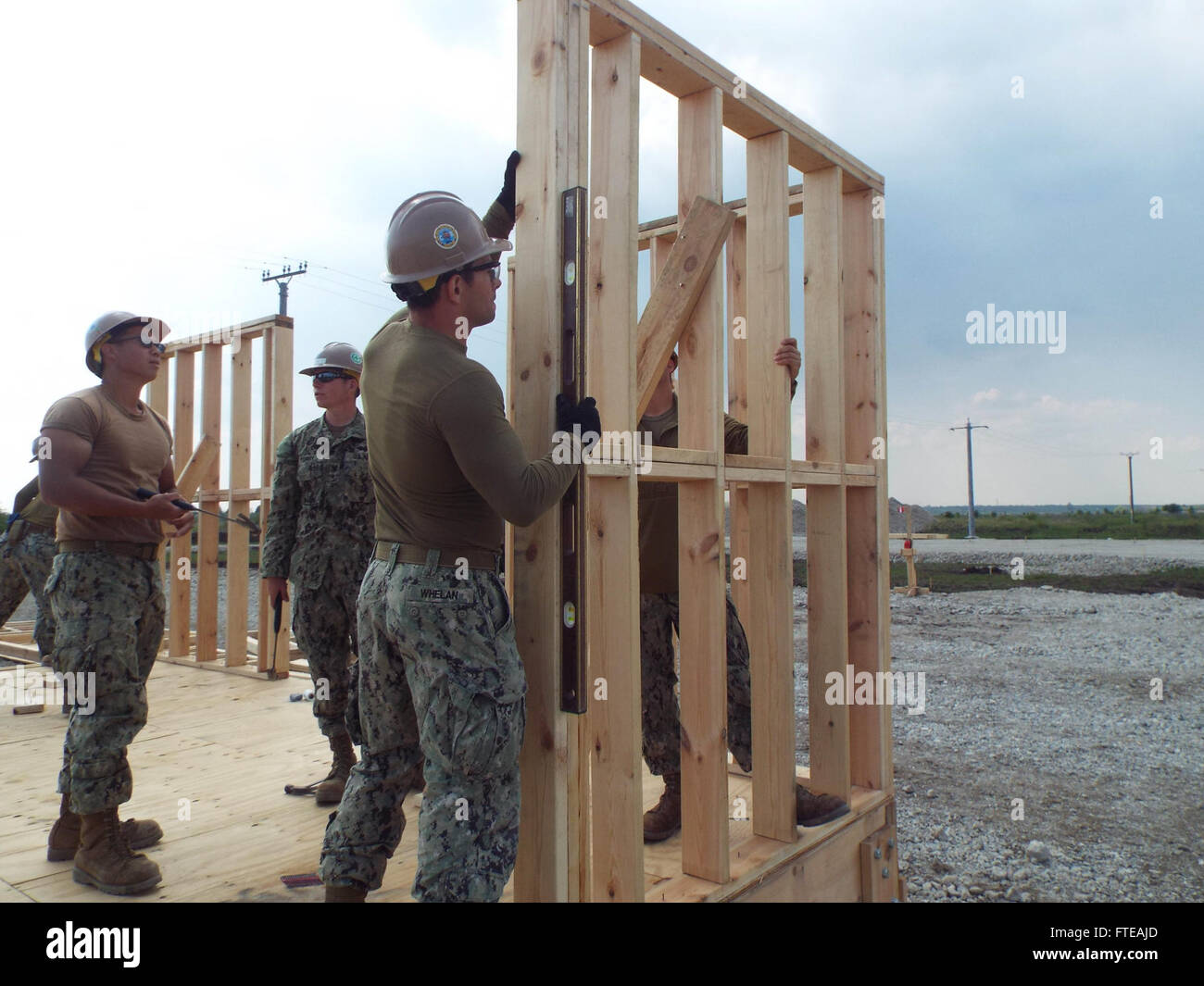 This U.S. Navy photo captures Builder 2nd Class Brian Whelan, along ...