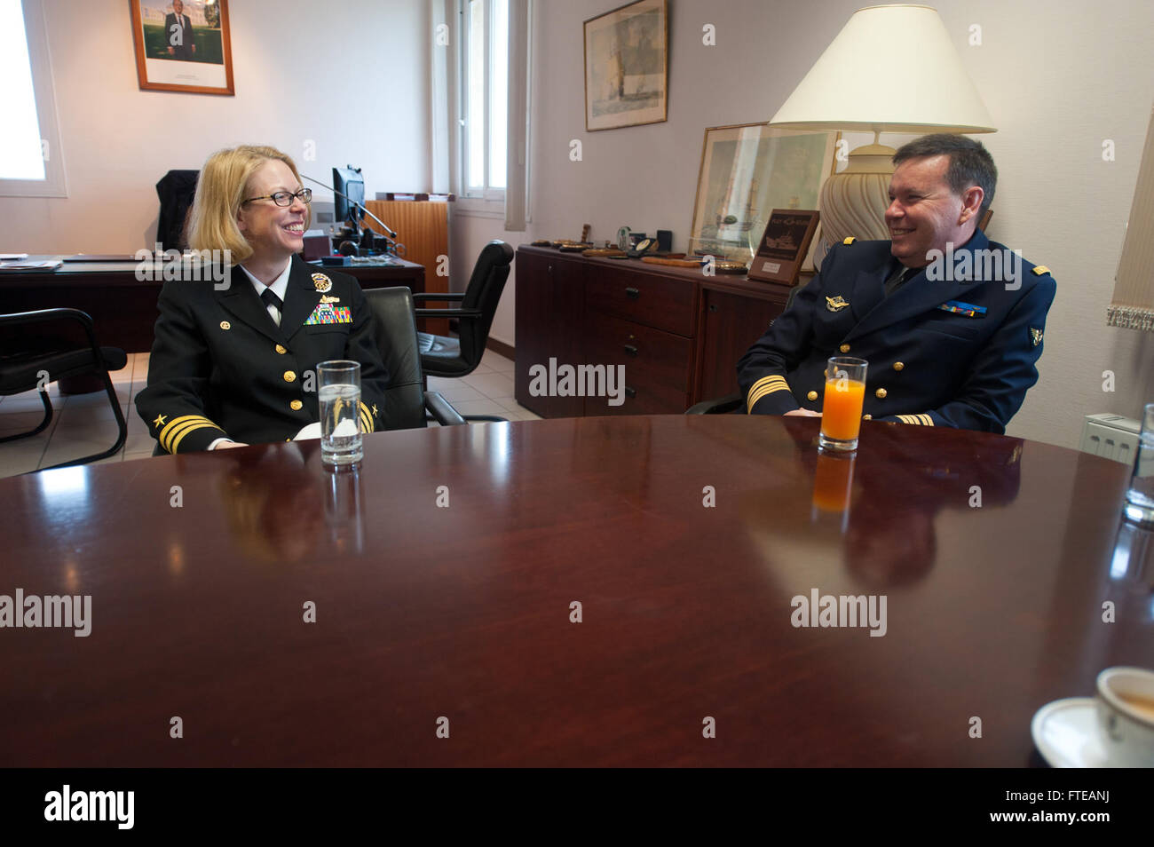 In this image, Cmdr. Camille Flaherty, commanding officer of the USS ...