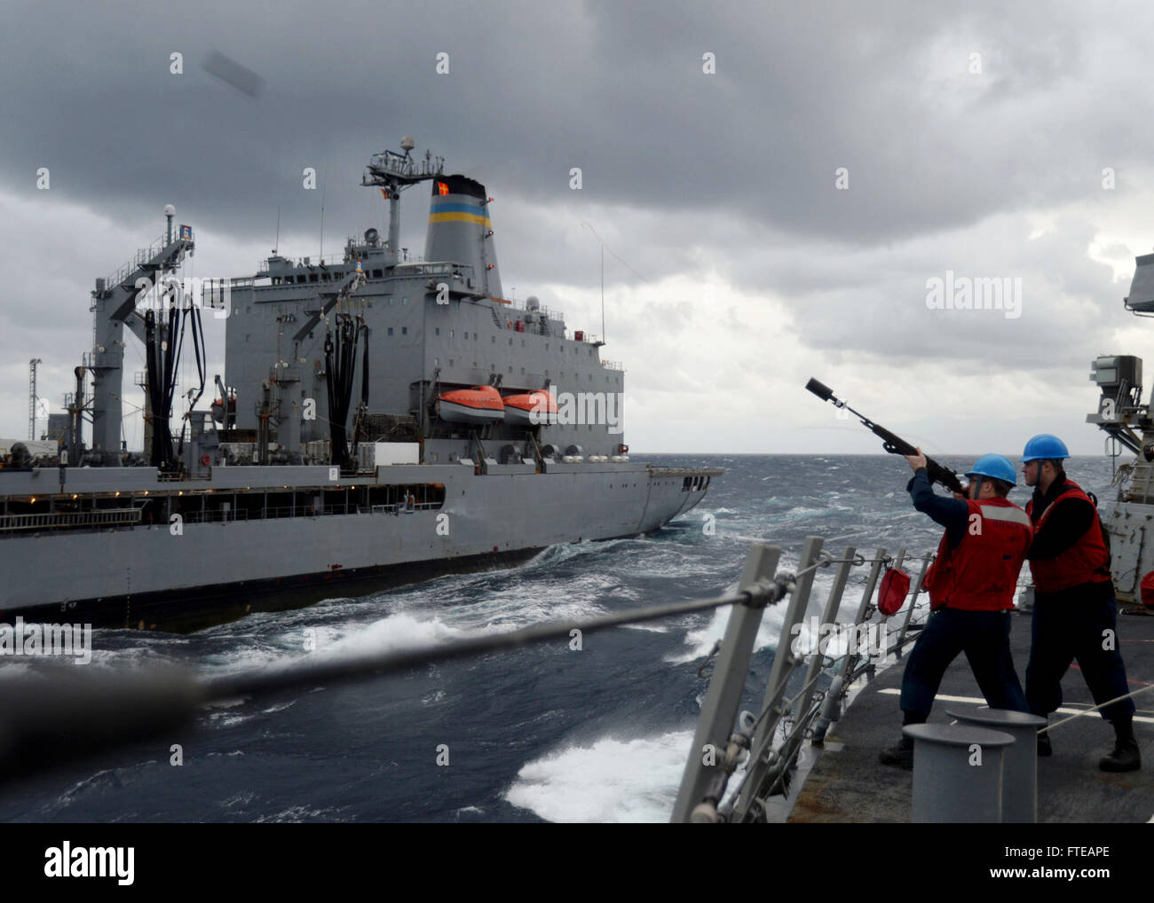 Gunner's Mate 2nd Class Douglas Ryder aboard the USS *Ramage* (DDG 61 ...