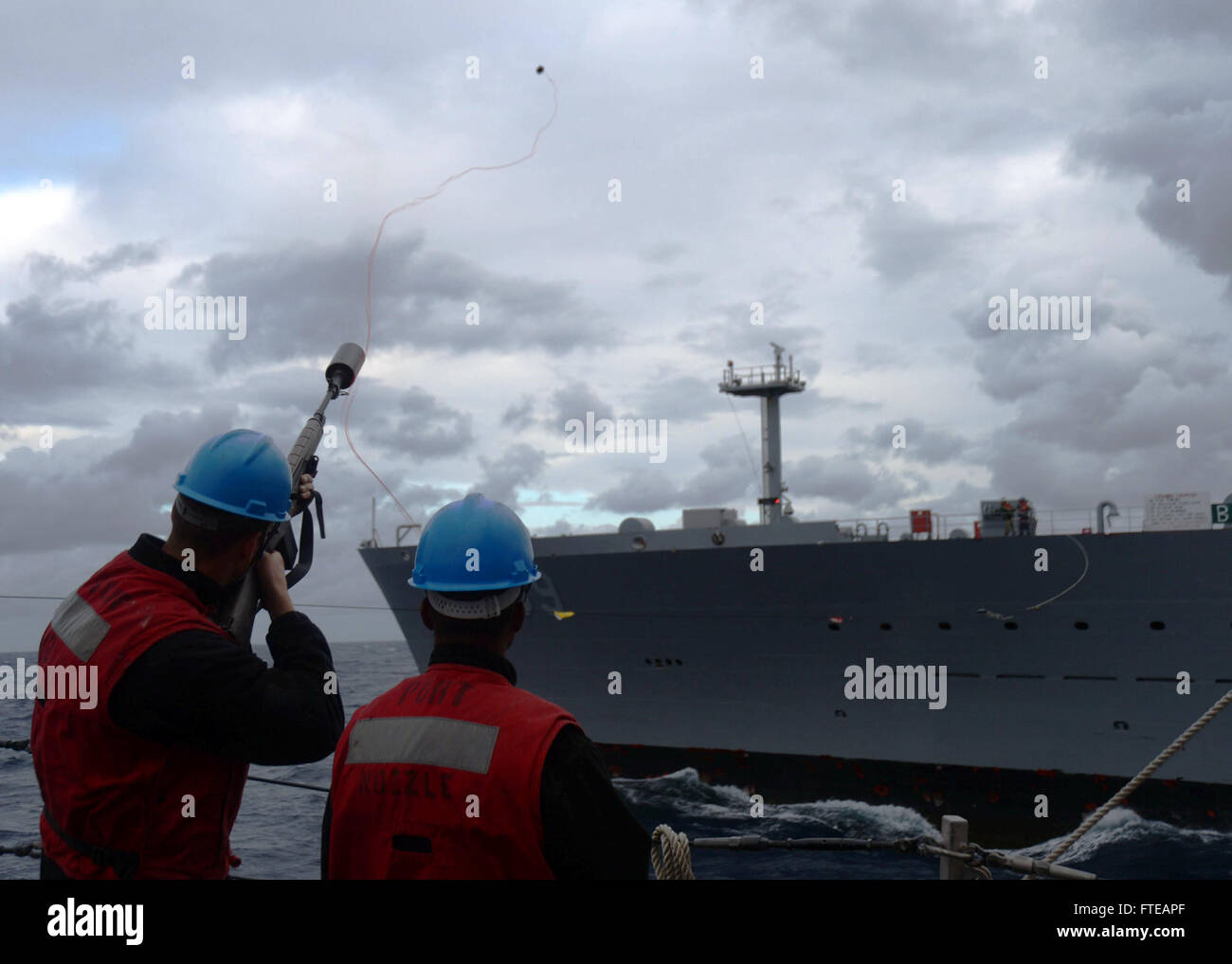 Gunner's Mate Seaman Robert Nunes aboard USS Ramage (DDG 61) fires a ...