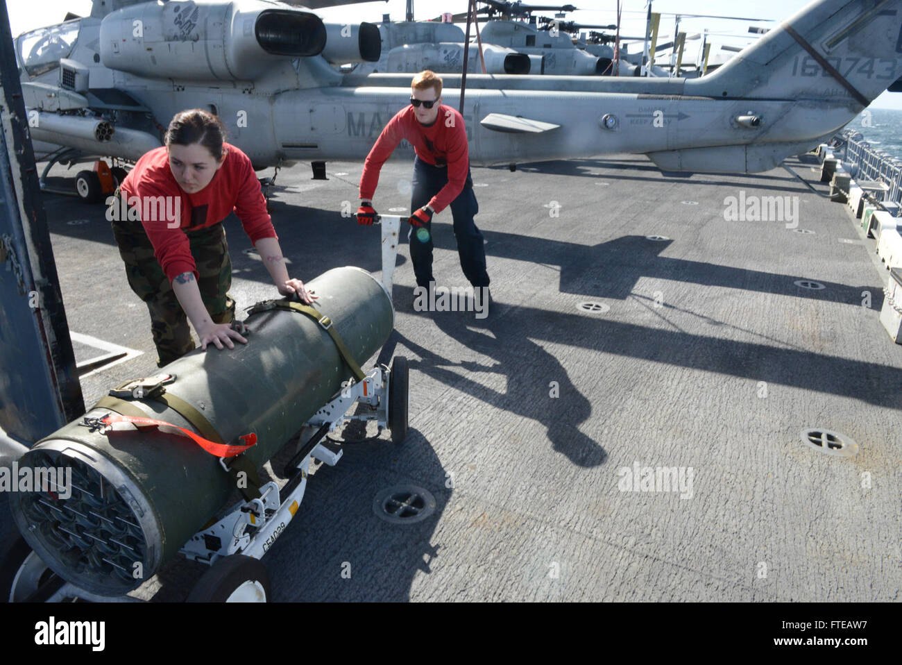 A U.S. Navy photo showing Aviation Ordnancemen Sydney Breazile and Kyle ...