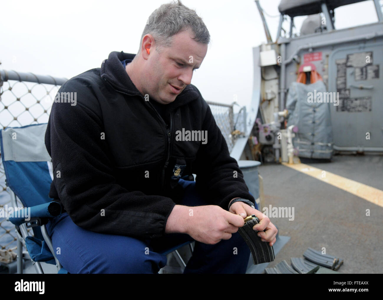 The USS Ramage (DDG 61), a guided-missile destroyer, is depicted in a ...