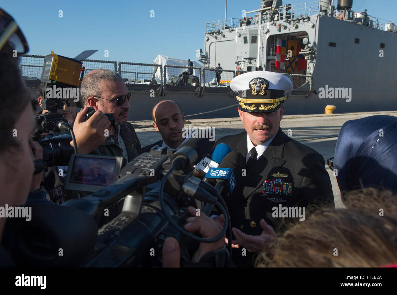 This image captures Cmdr. Christopher Follin, commanding officer of USS ...