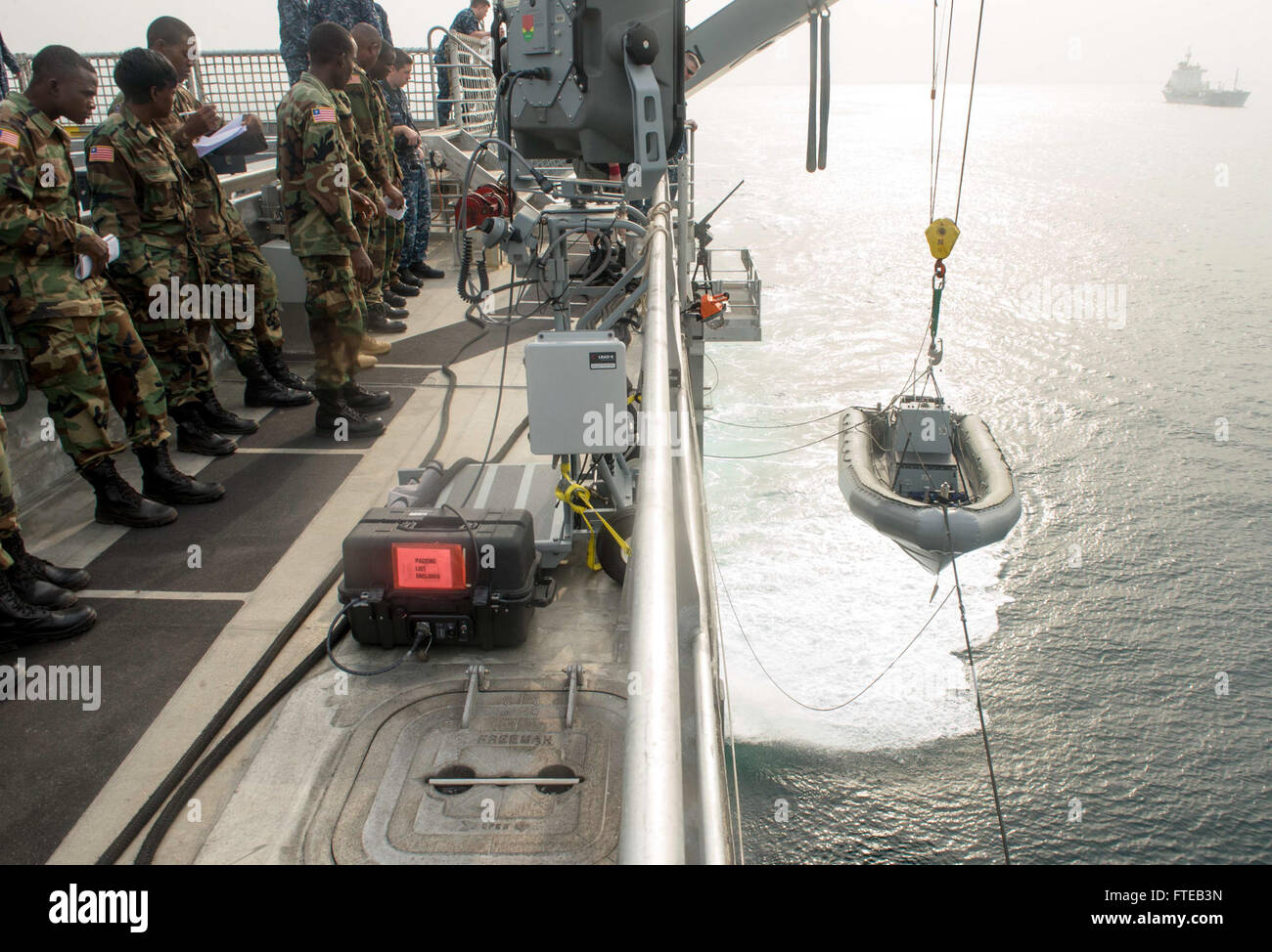 U.S. Navy Sailors and Liberian Coast Guard observe operations during a ...