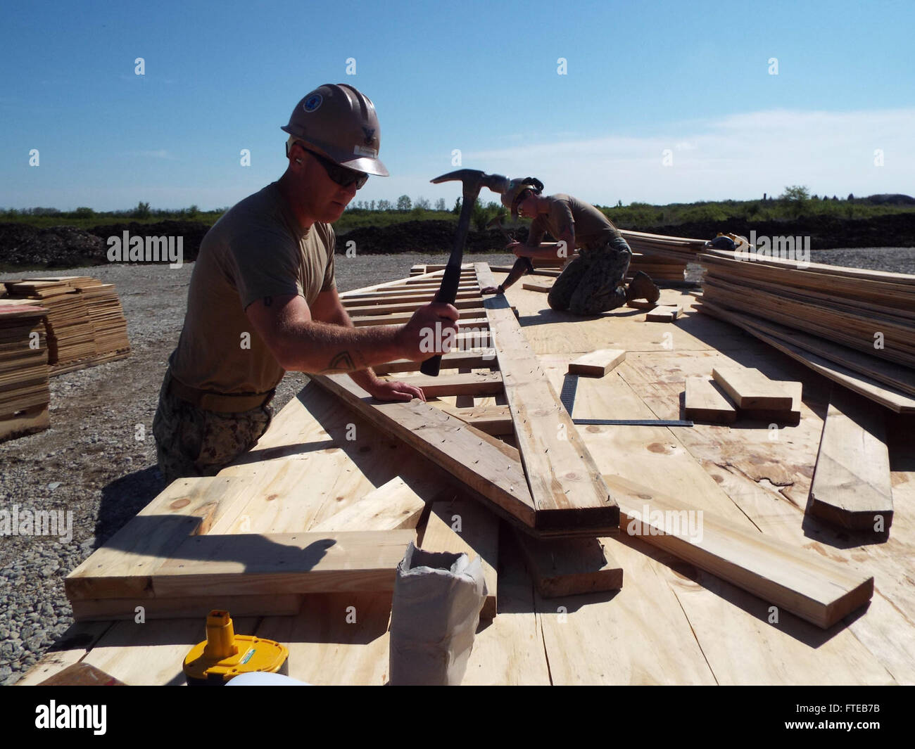 This U.S. Navy photo shows Builder 2nd Class Jason Katzenberger and ...