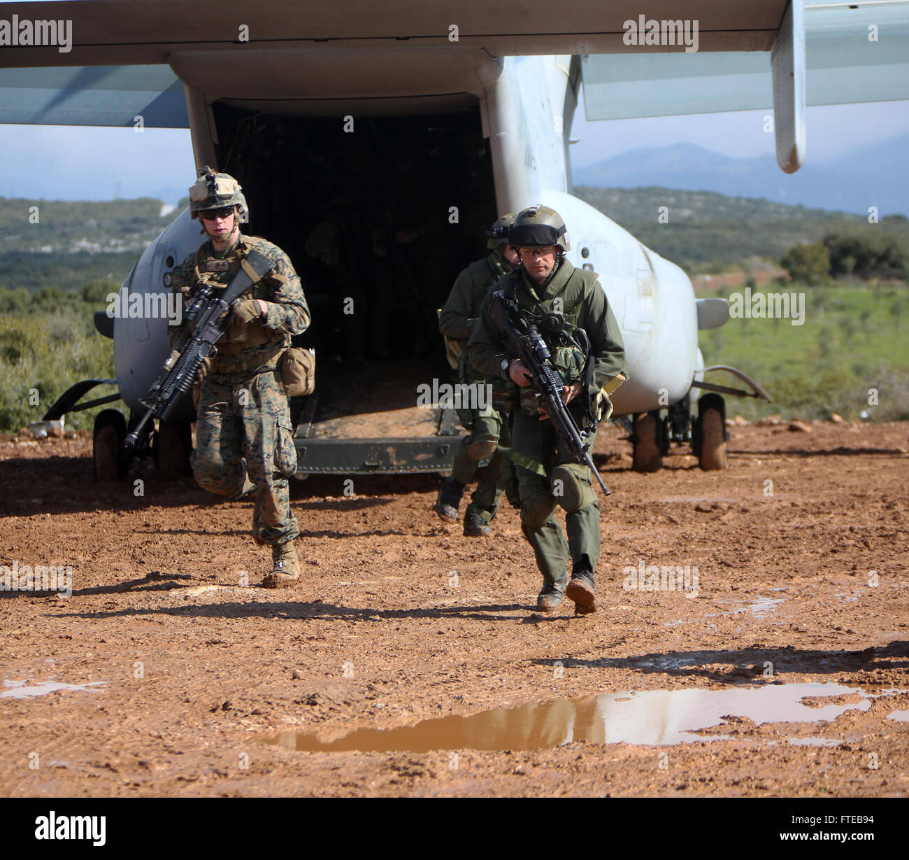 U.S. Marines and Hellenic Army members exit an MV-22 Osprey during a ...
