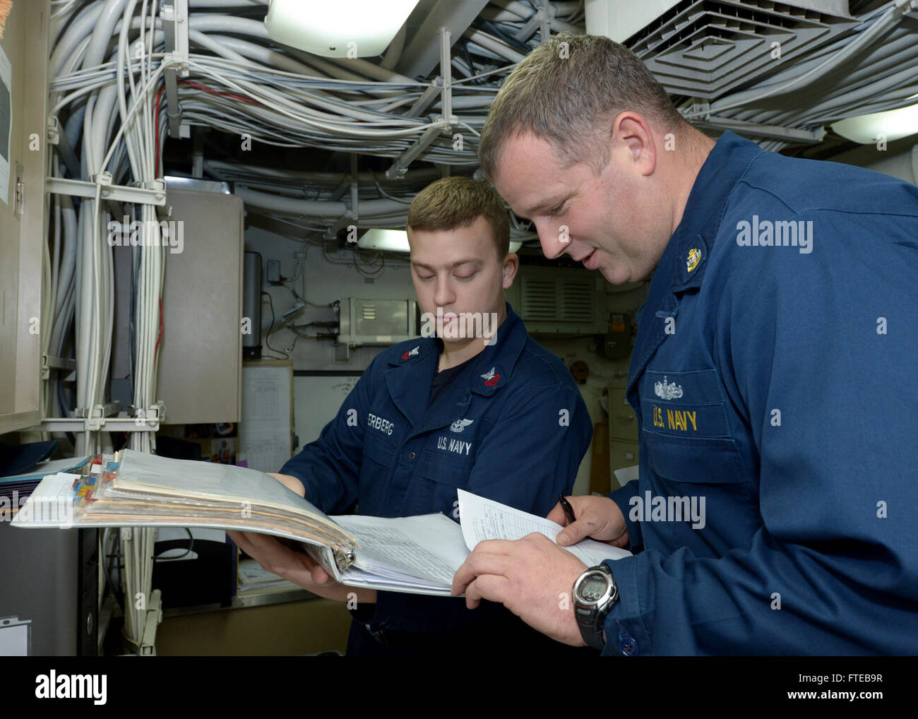A U.S. Navy crew member, Chief Gunner's Mate Jason Peugh, conducts a 3M ...