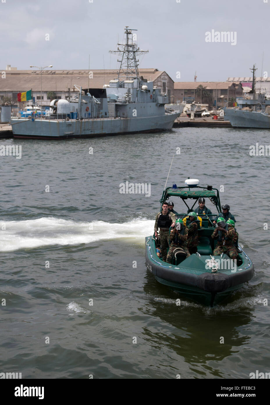 Liberian servicemembers aboard a Spanish Guardia Civil small craft ...