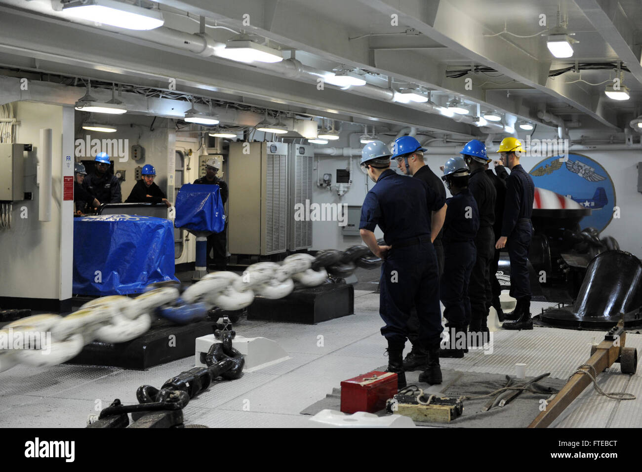 Sailors aboard the USS George H.W. Bush (CVN 77) drop the starboard ...