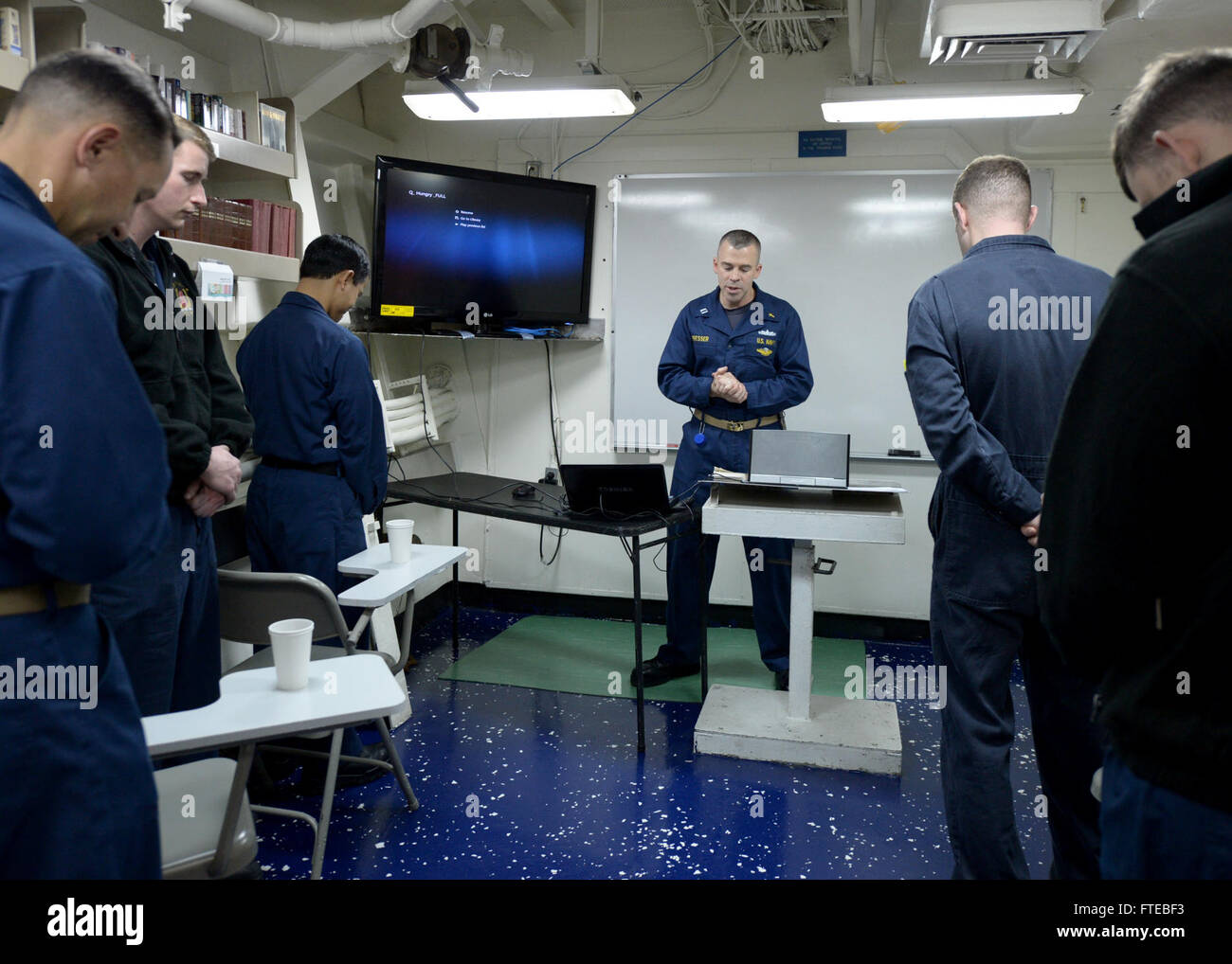 Lt. Allen Presser, aboard the USS Ramage (DDG 61), conducts a Christian ...