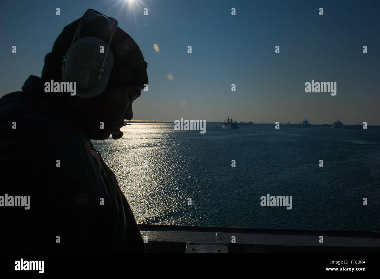 The image features Quartermaster Seaman Trevante Hardrick standing ...