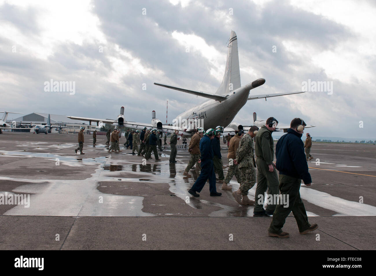 Sailors from Patrol Squadron 9 (VP-9), known as the 'Golden Eagles ...