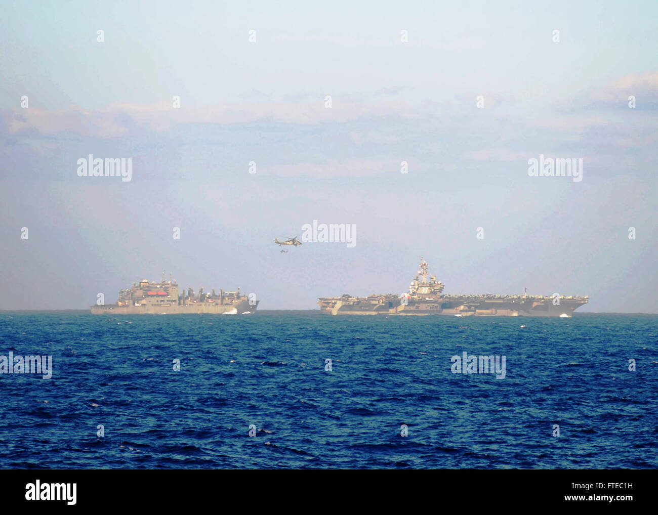 The USS George H.W. Bush (CVN 77) aircraft carrier approaches a supply ...