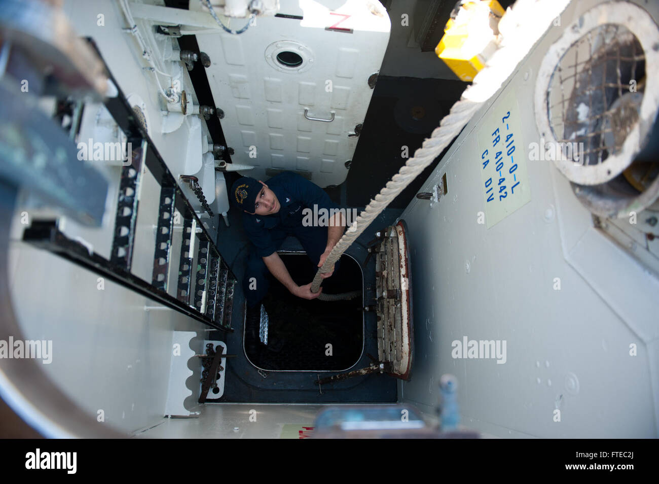 Gunner's Mate 3rd Class Jacob Jones secures a mooring line as the USS ...