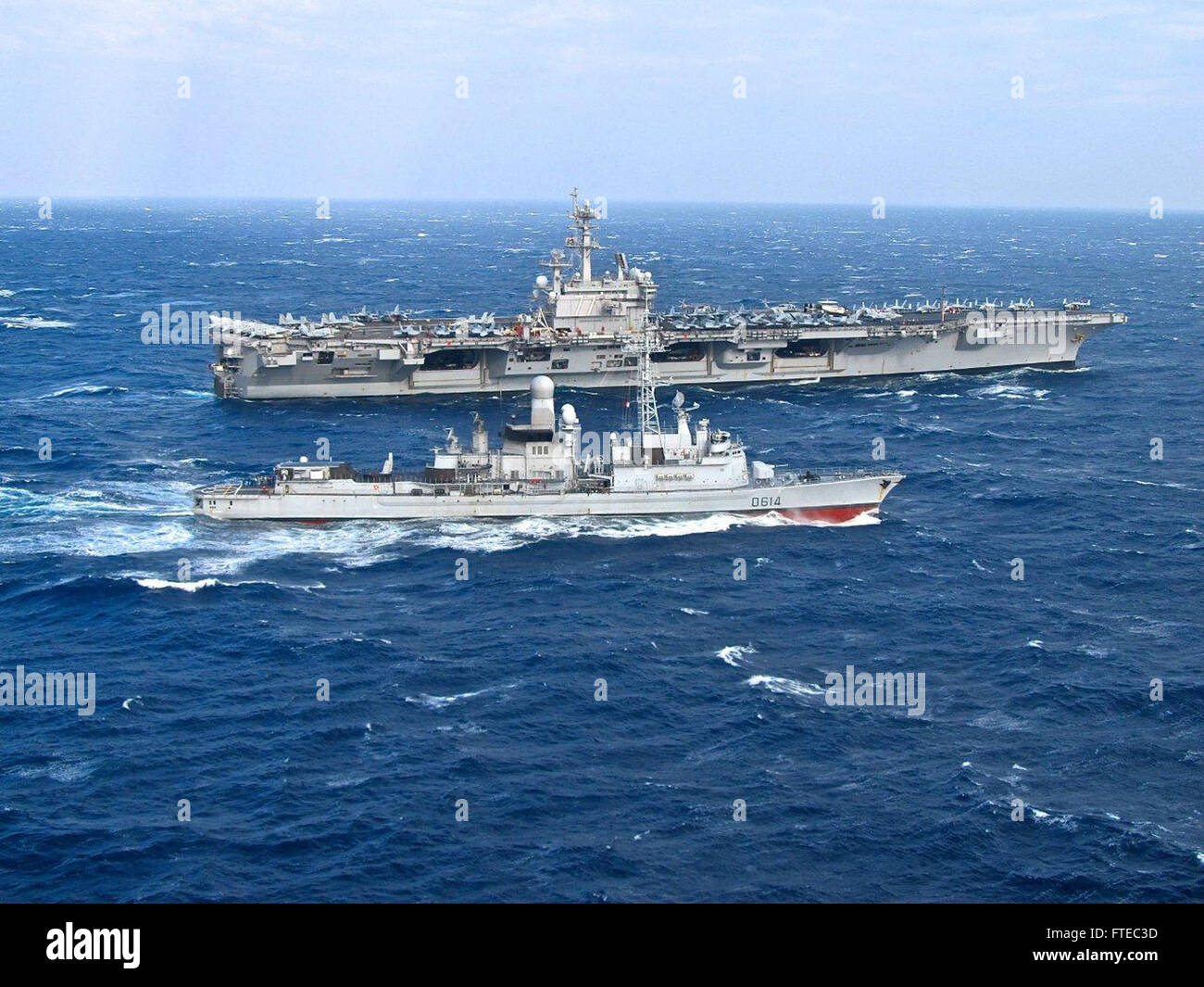 The French frigate FS Cassard (D614) passes alongside the USS George H ...