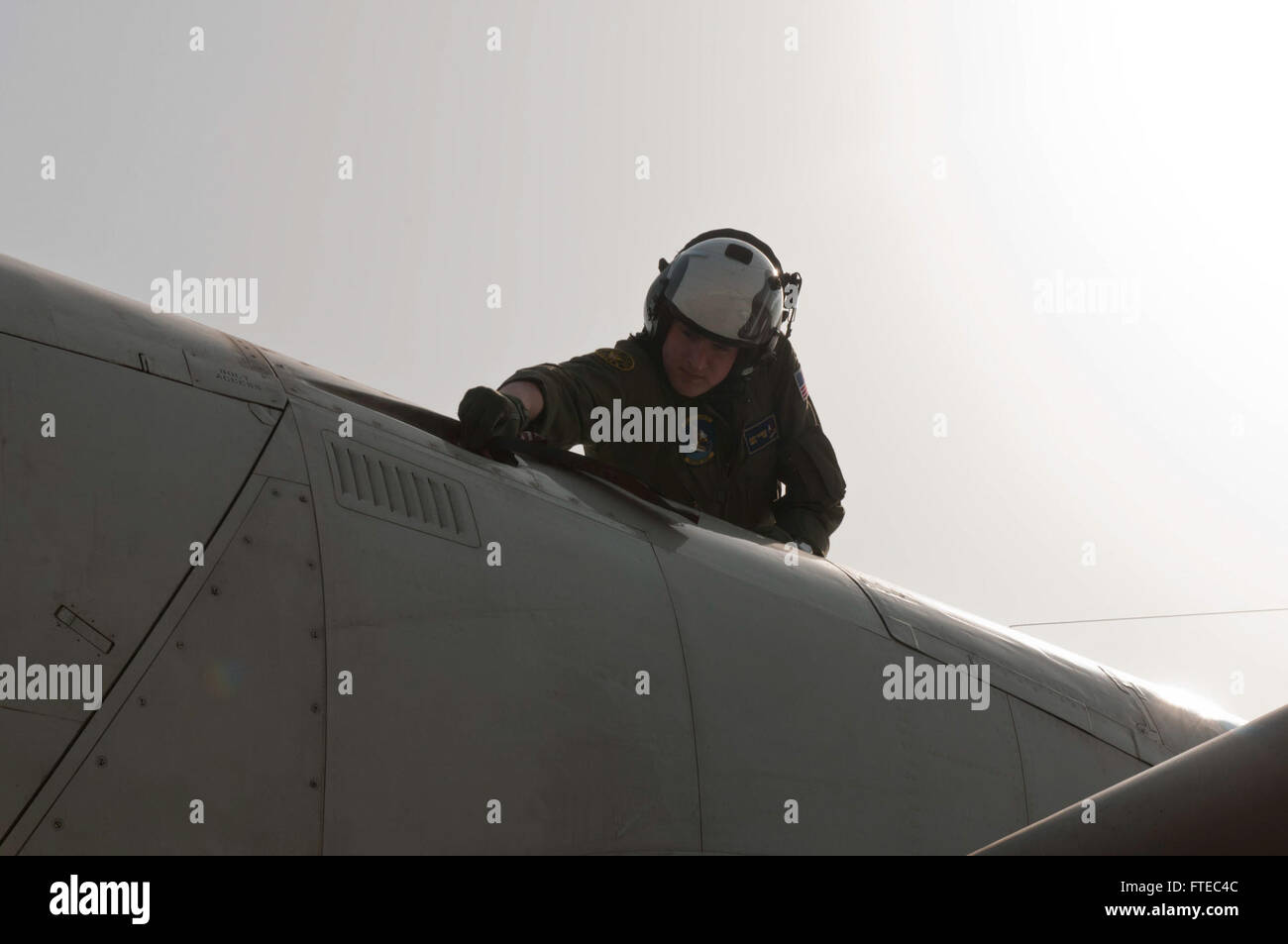 Naval Aircrewman Operator 3rd Class Cody Dobson of VP-9 is seen placing ...