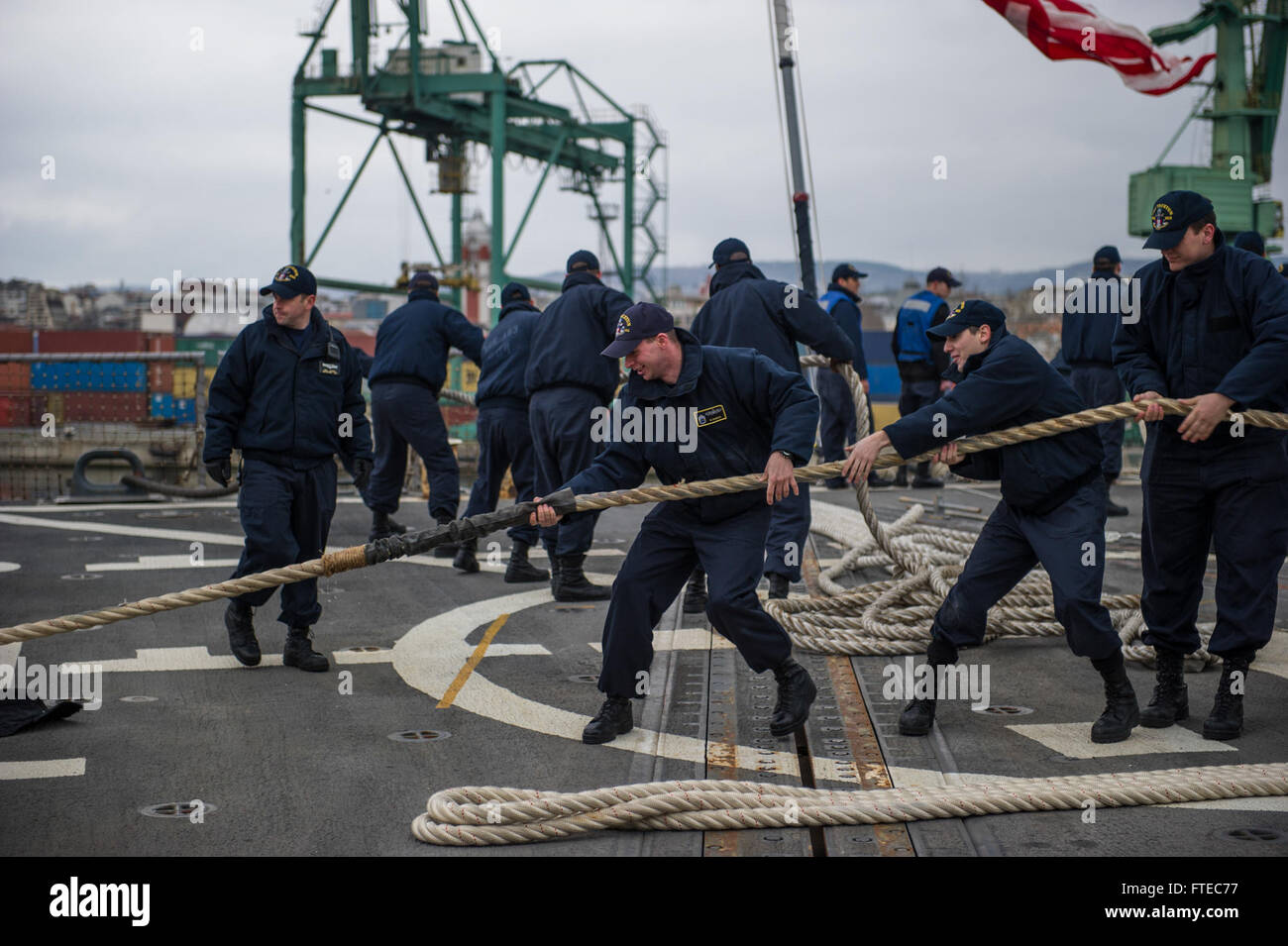 Sailors aboard the USS Truxtun (DDG 103), an Arleigh Burke-class guided ...