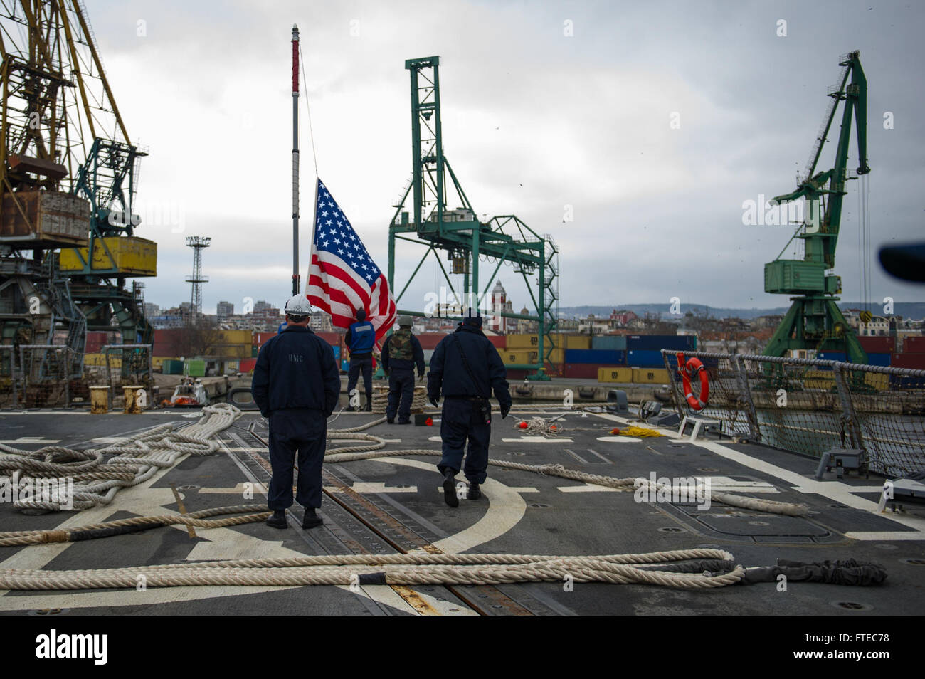 This photograph shows sailors aboard the USS Truxtun (DDG 103), an ...