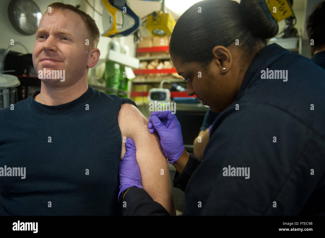 Hospital Corpsman 3rd Class Michelle Bracey administers a smallpox ...