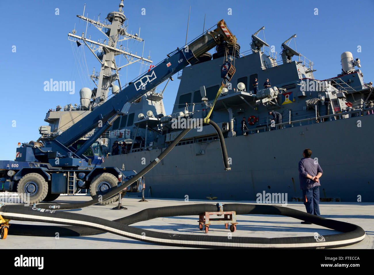 The USS Cook (DDG 75), a guided missile destroyer, is seen refueling at ...