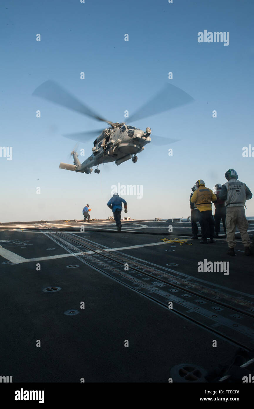 Sailors aboard the USS Truxtun (DDG 103) participate in a helicopter in ...