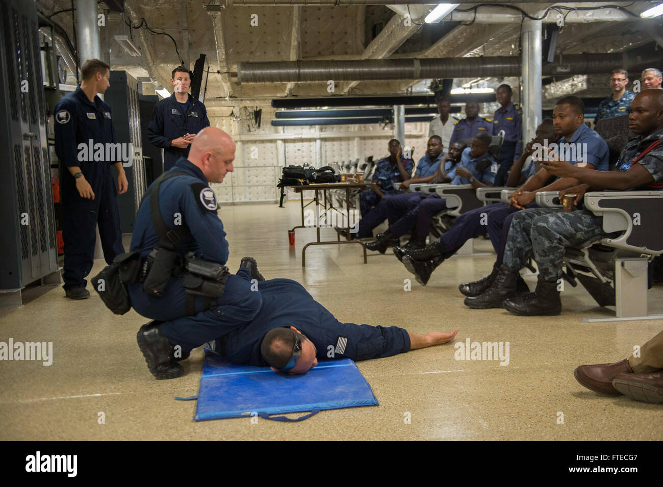 U.S. Coast Guard personnel aboard the USNS Spearhead, conducting joint ...