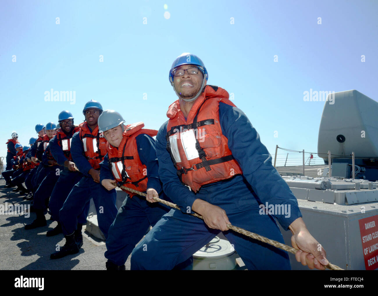Sailors aboard the USS Ramage (DDG 61) conduct line handling during a ...