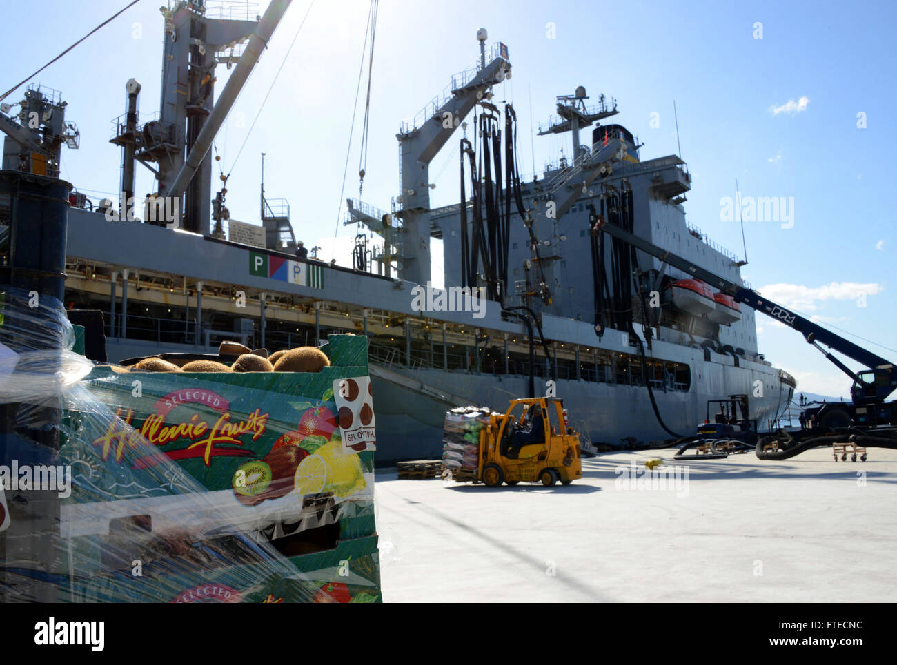 The image shows the USNS John Lenthall, a fleet replenishment oiler ...