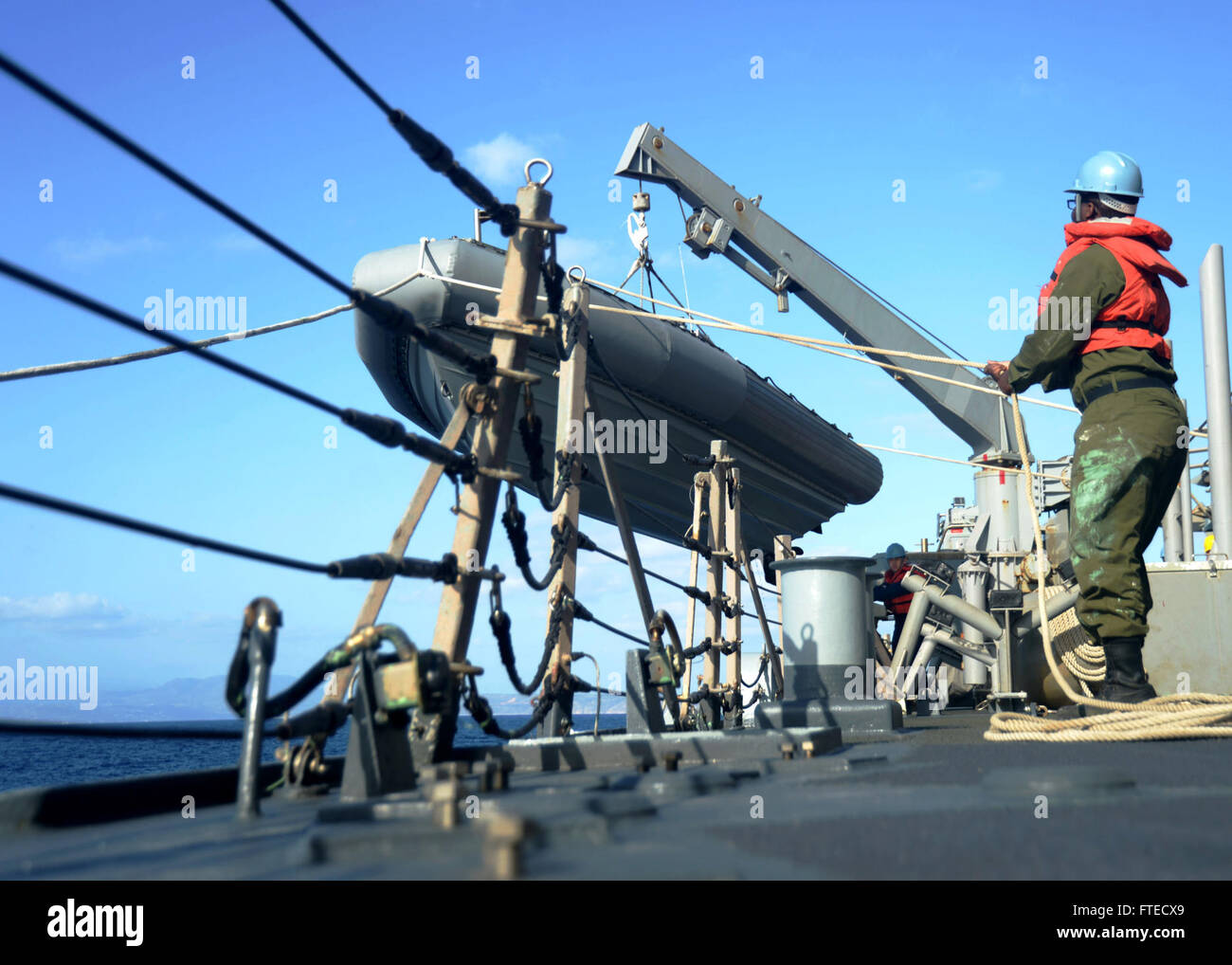 Seaman Kenneth Moore, assigned to the guided-missile destroyer USS ...