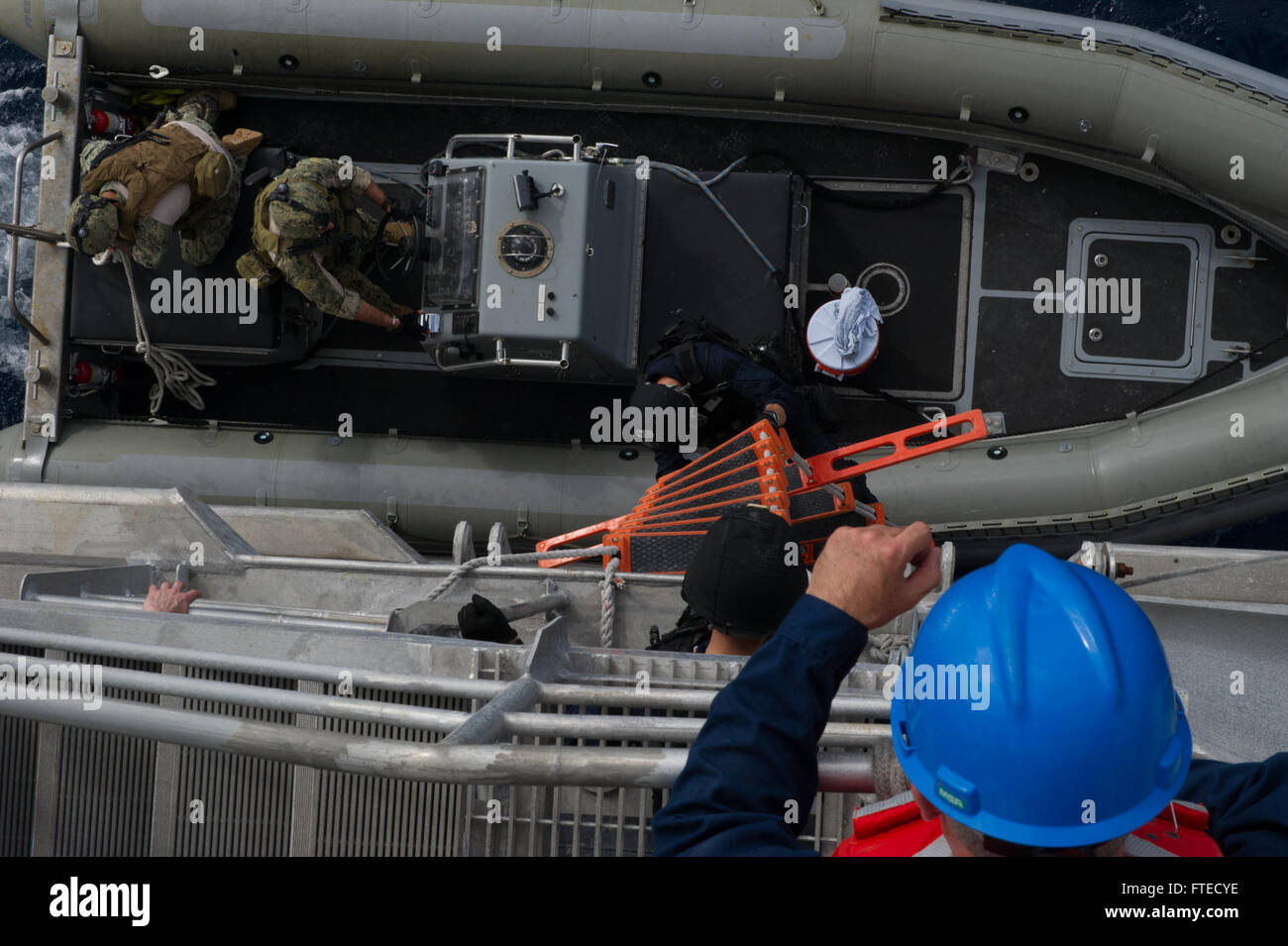 In this image, members of the U.S. Coast Guard’s law enforcement ...