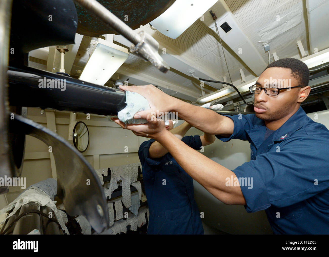 Sonar Technician 3rd Class Michael Jones operates the tactical towed ...