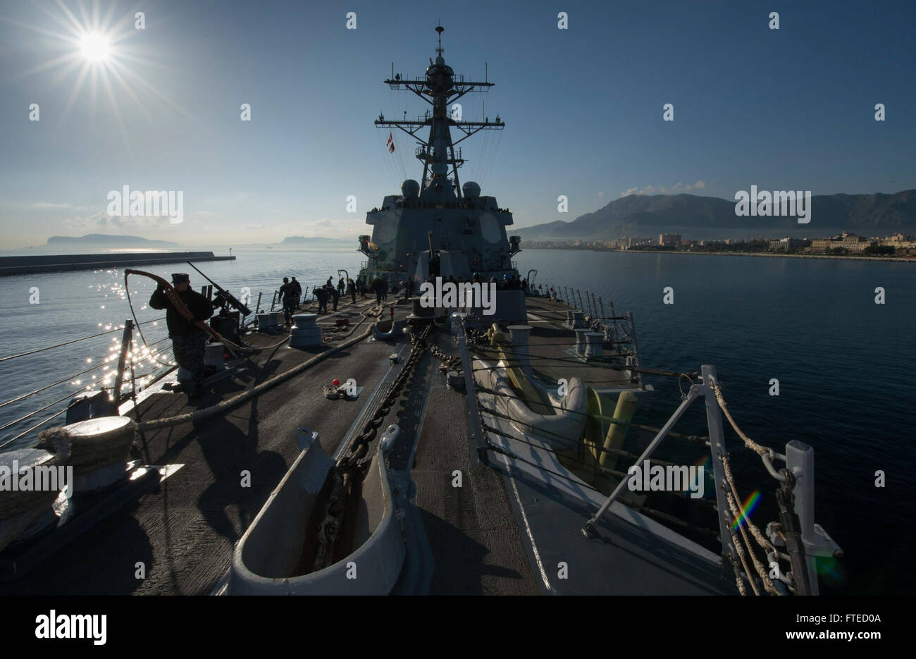 Sailors aboard the USS Mason (DDG 87) prepare for entering port at ...