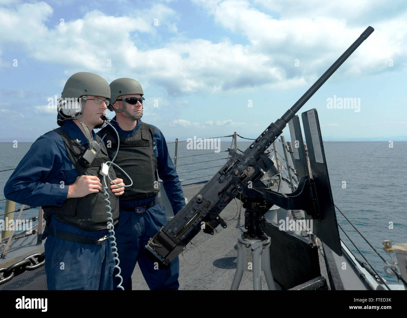This photograph shows sailors aboard the USS Ramage (DDG 61) standing ...