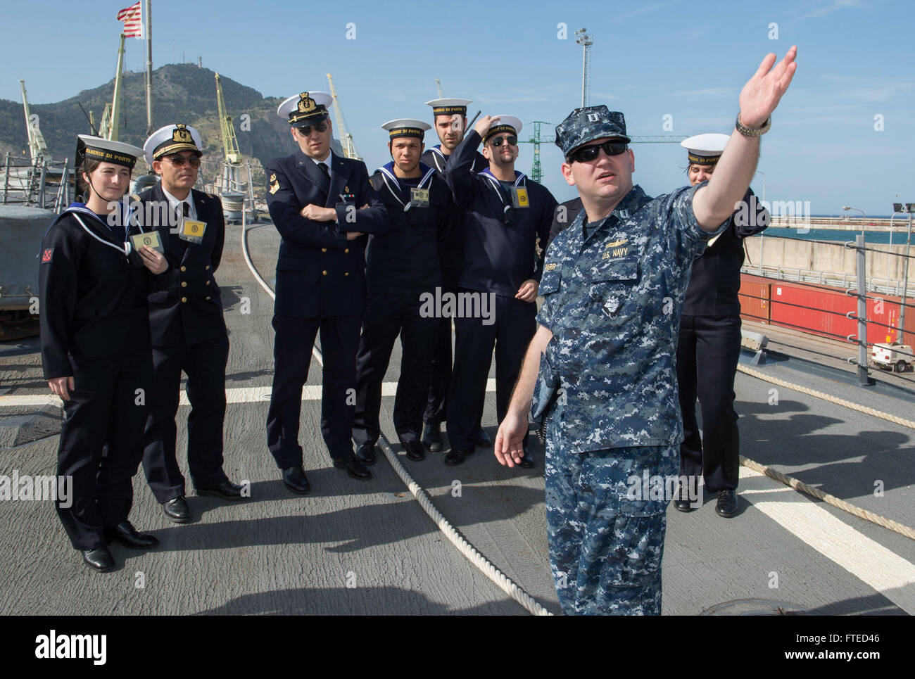 Lt. Mathew Parr, weapons officer aboard USS Mason (DDG 87), provides a ...
