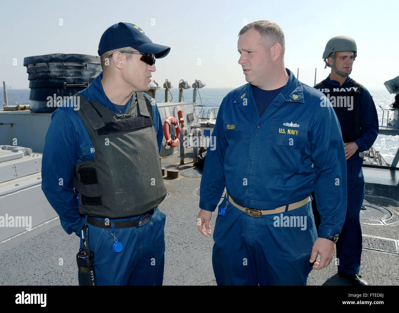 This image shows Chief Gunner's Mate Jason Peugh monitoring gunnery ...