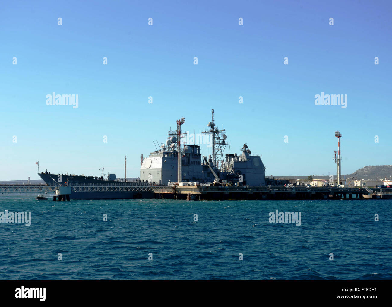 The USS Vella Gulf (CG 72), a guided-missile cruiser, is docked in ...