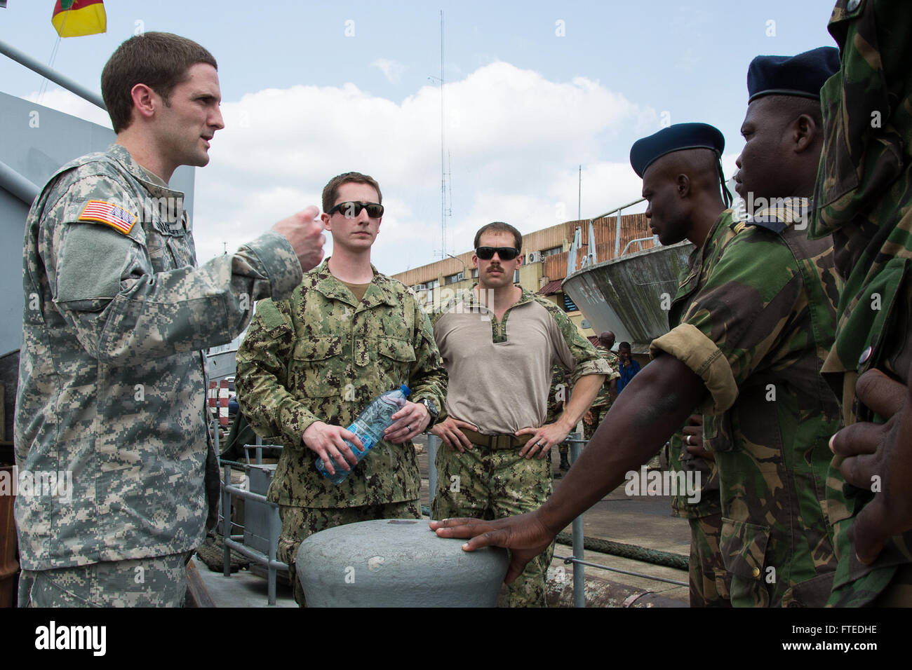 U.S. Army Sergeant Richard Stanger facilitates a boarding procedure ...