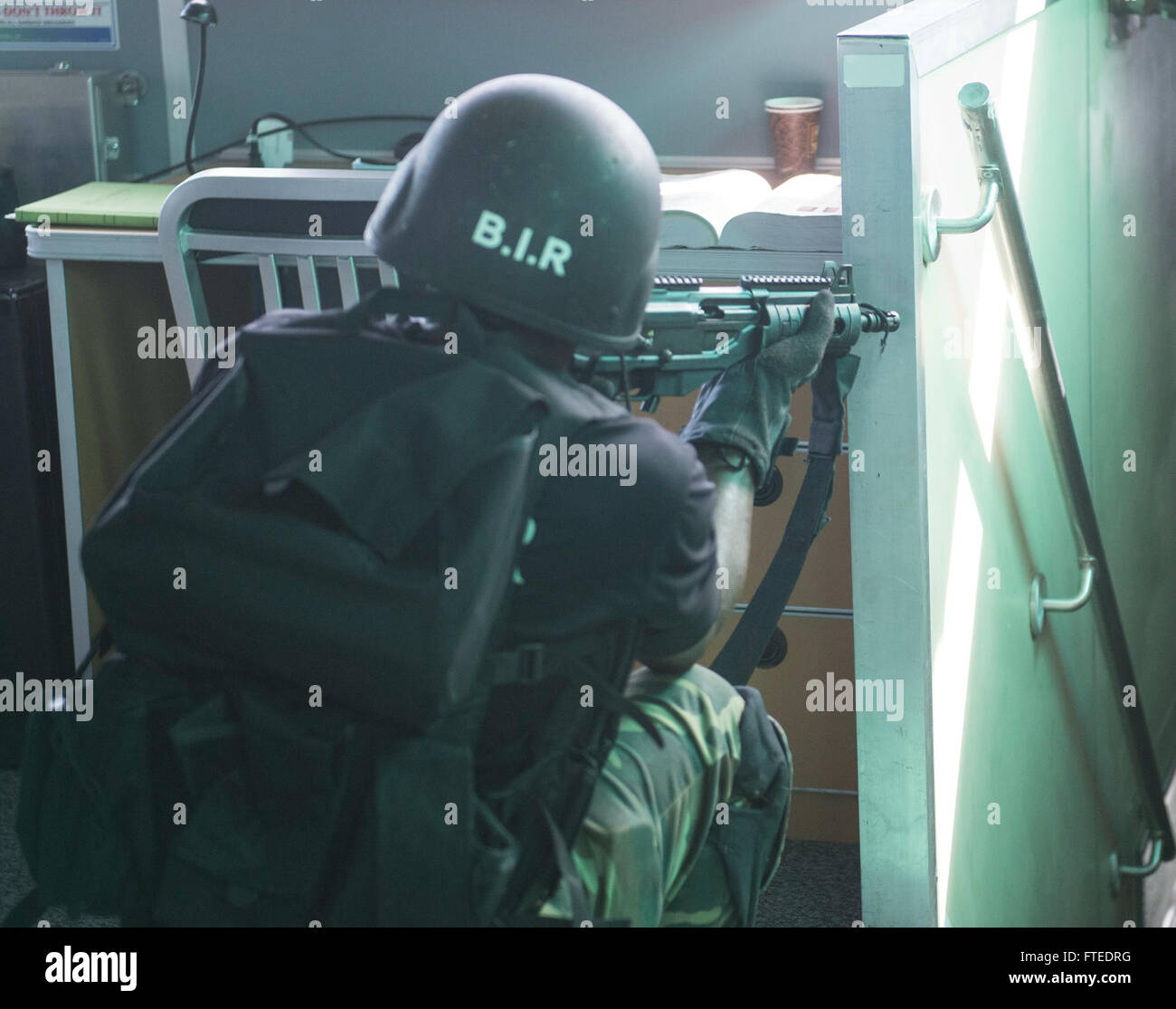 A member of the Cameroonian Rapid Intervention Battalion (BIR) prepares ...