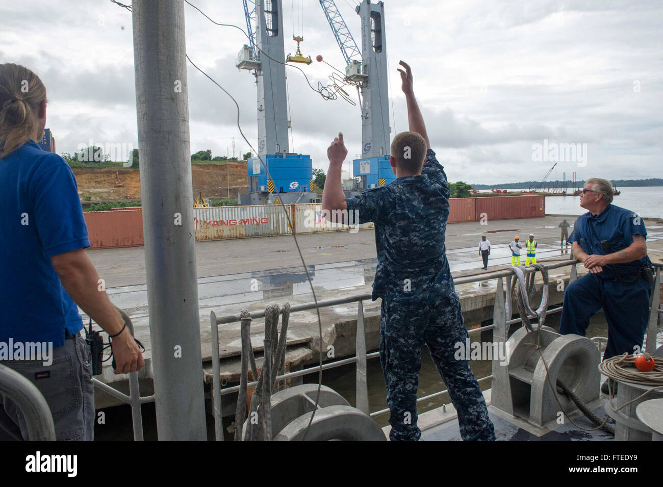 The photo shows a U.S. Navy sailor assigned to the USNS Spearhead (JHSV ...