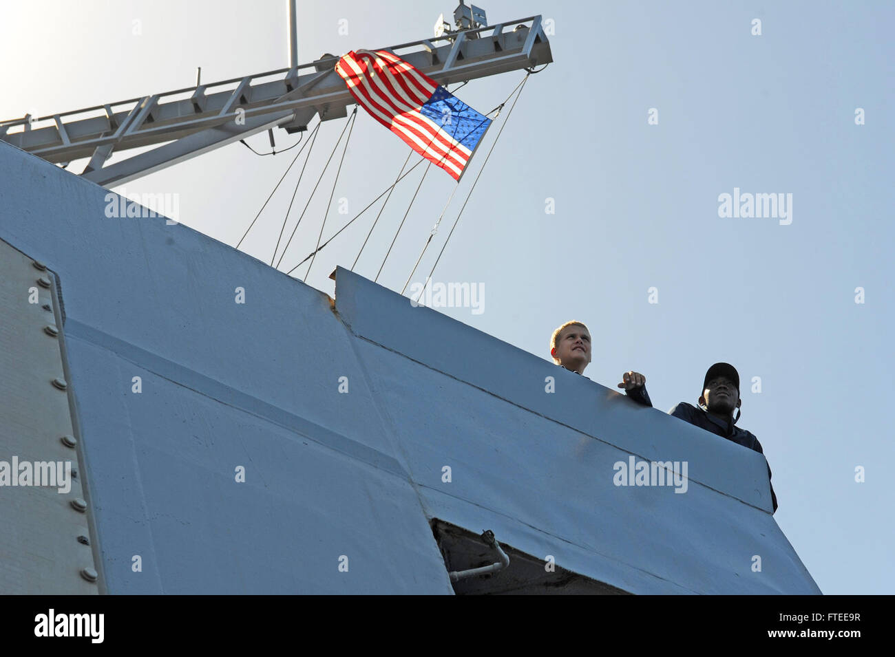 On September 16, 2013, sailors aboard the USS Ramage (DDG 61) stood ...