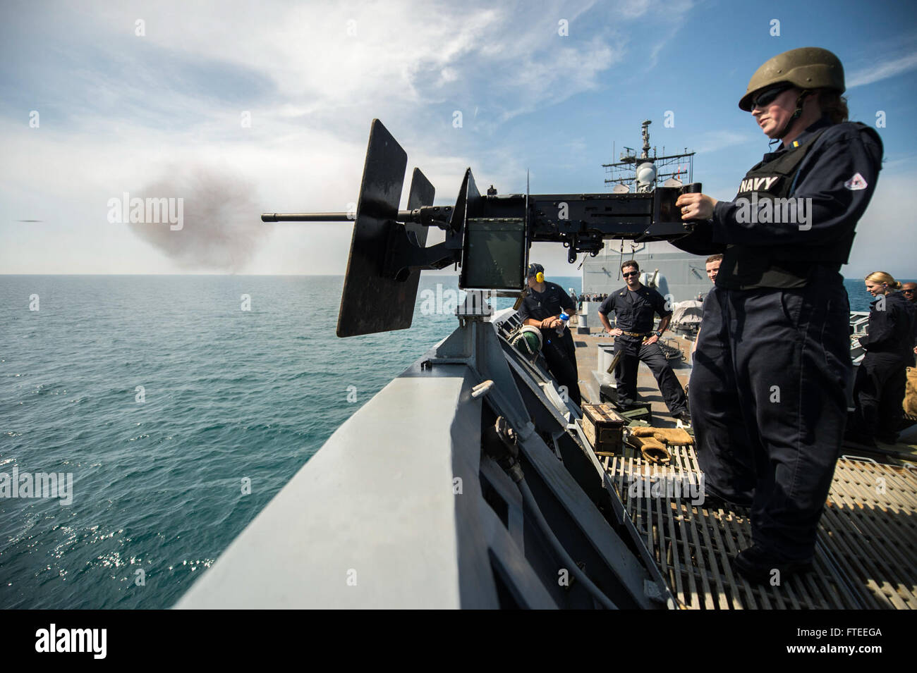 Ensign Molly Crowell fires a .50 caliber machine gun during a live-fire ...