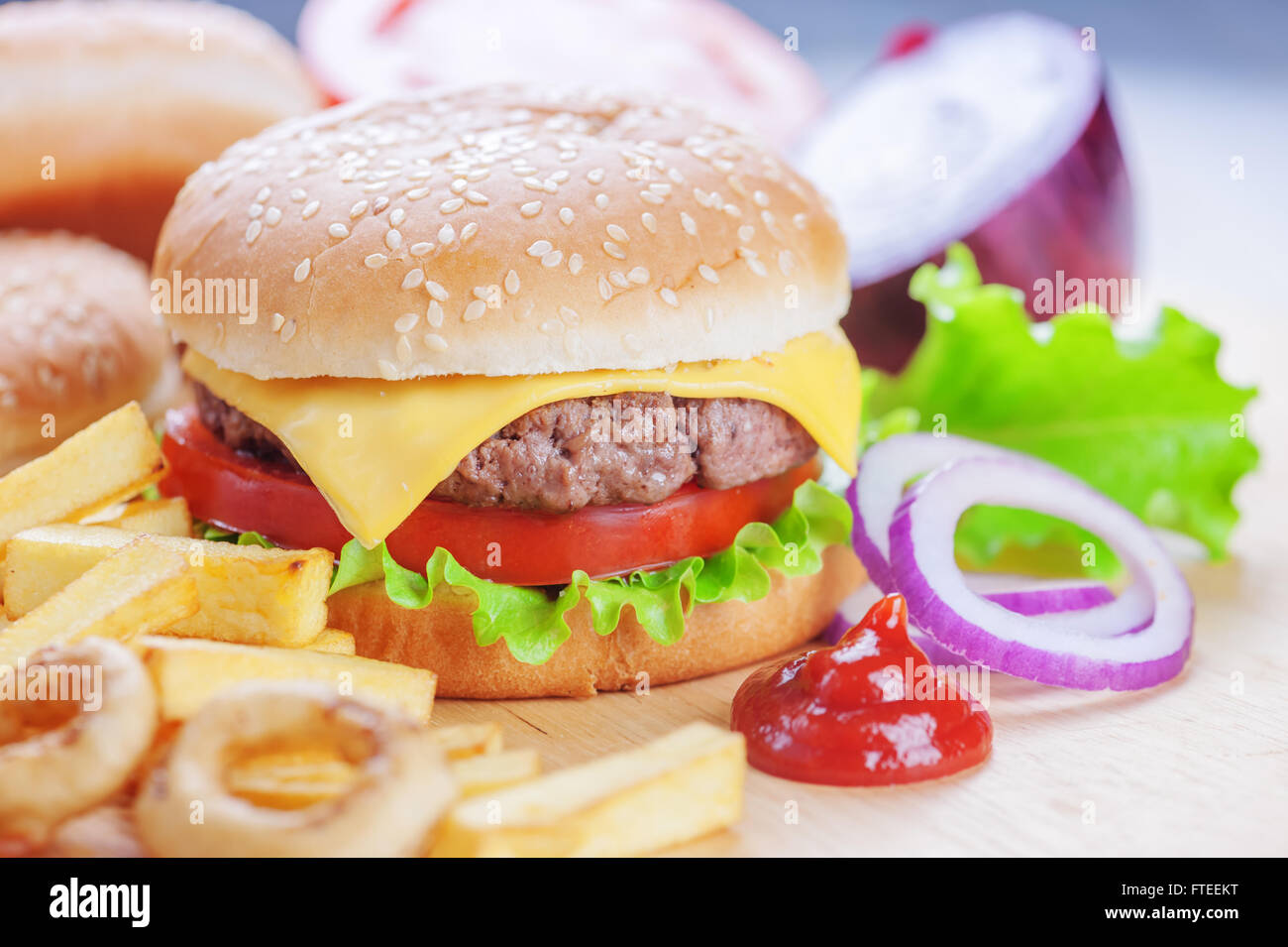 appetizing cheeseburger with red onion closeup Stock Photo - Alamy