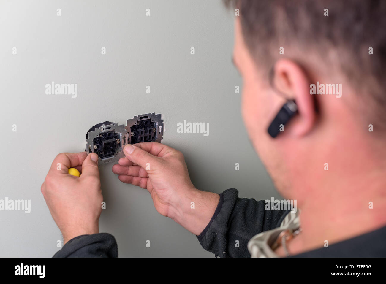 electrician installing the electricity system Stock Photo - Alamy