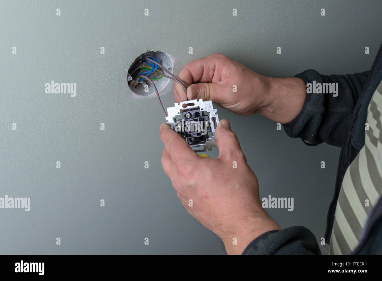 electrician installing the electricity system Stock Photo - Alamy