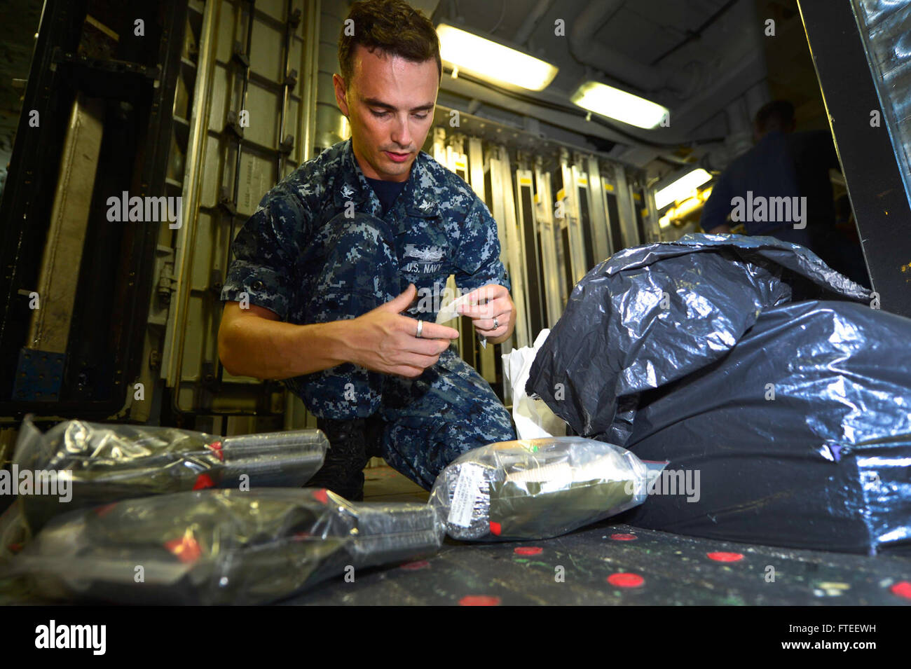 Hospital Corpsman 3rd Class Jesse LeFlesch conducts an inventory of ...
