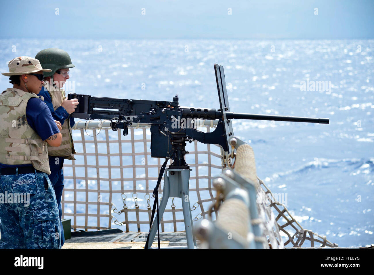 Gunner's Mate 2nd Class Jourdan Owens coaches Gunner's Mate 3rd Class ...